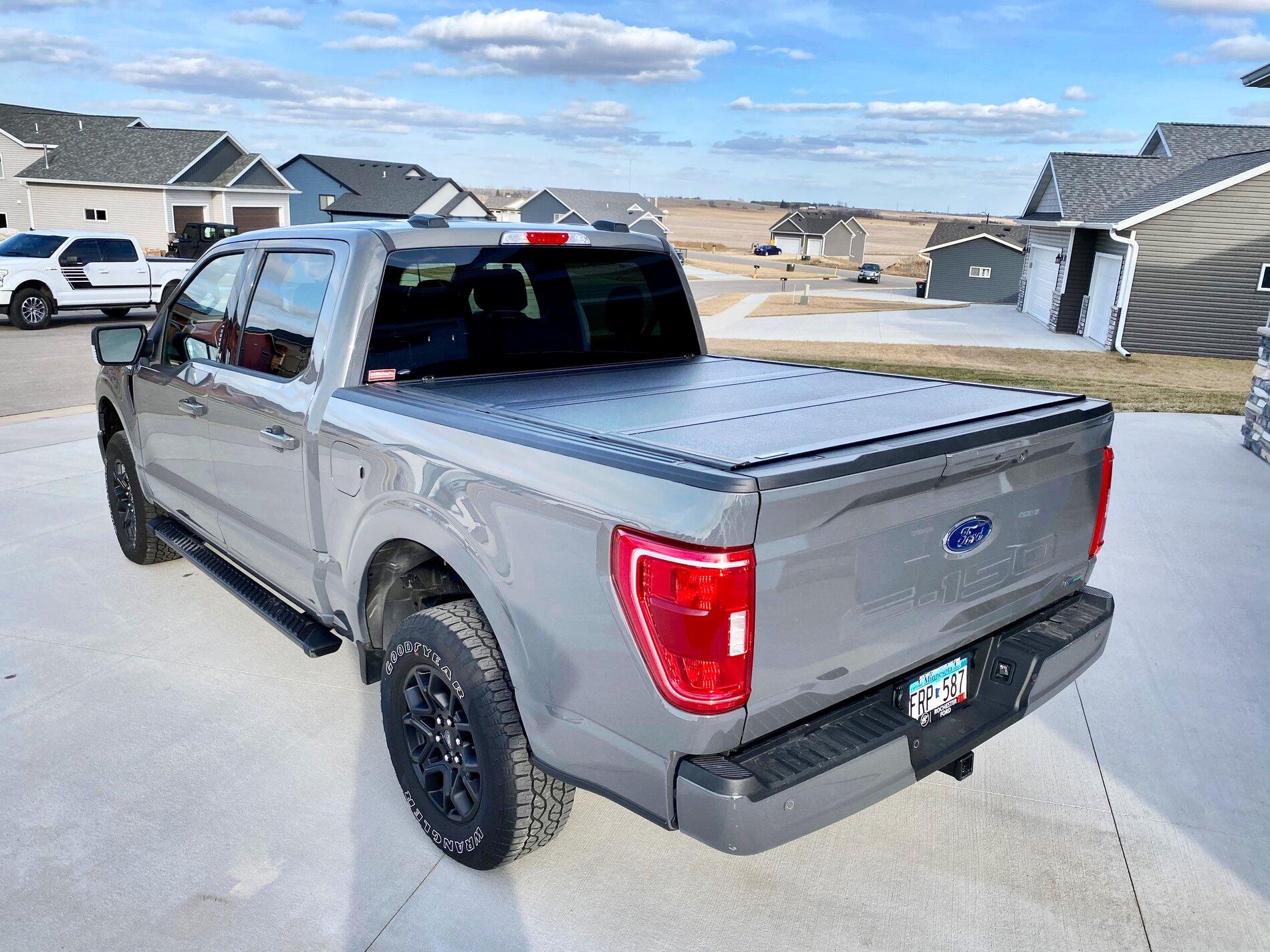 Finally got my bed setup: bed liner, tonneau cover, and bed divider ...
