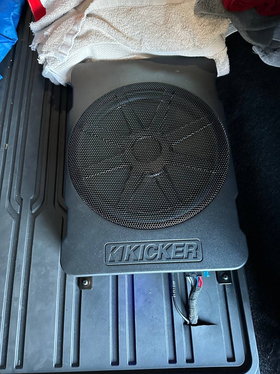 What’s the most cost effective way to add a 10” or 12” Sub behind the drivers rear seat ...